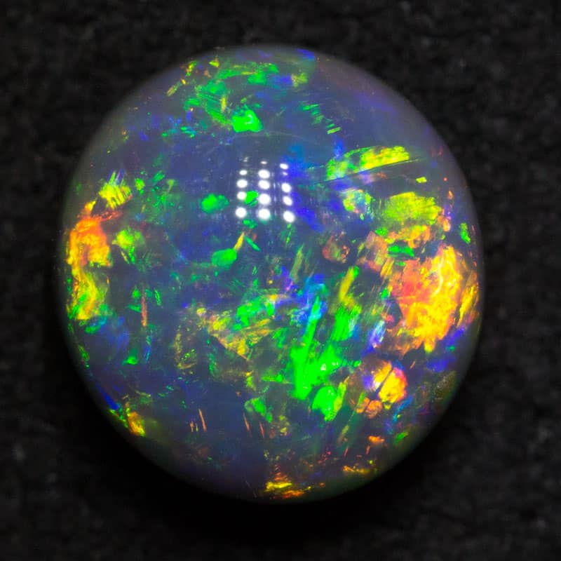 1.52 ct black opal 7.4x6.9x5mm