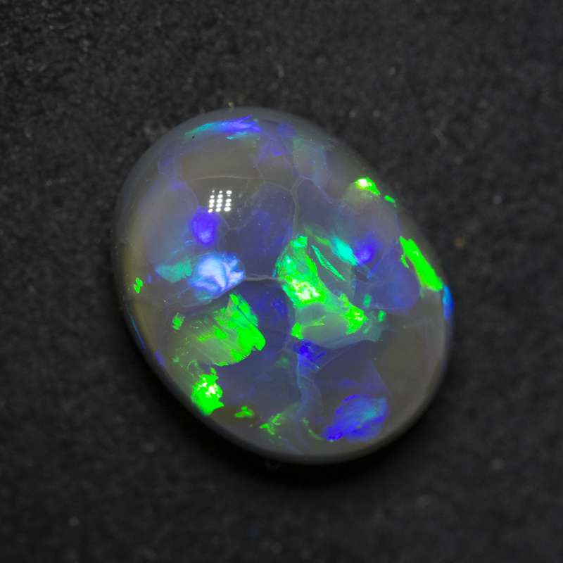 4.56 ct black opal 12.2x9.4x6.4mm