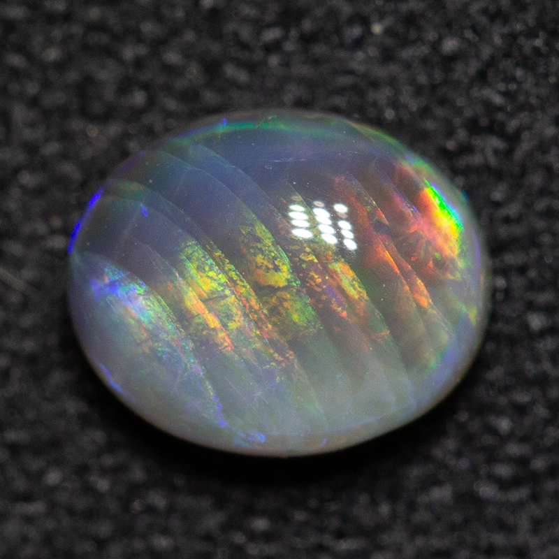 0.66 ct dark opal 6.2x5.2x3.1mm