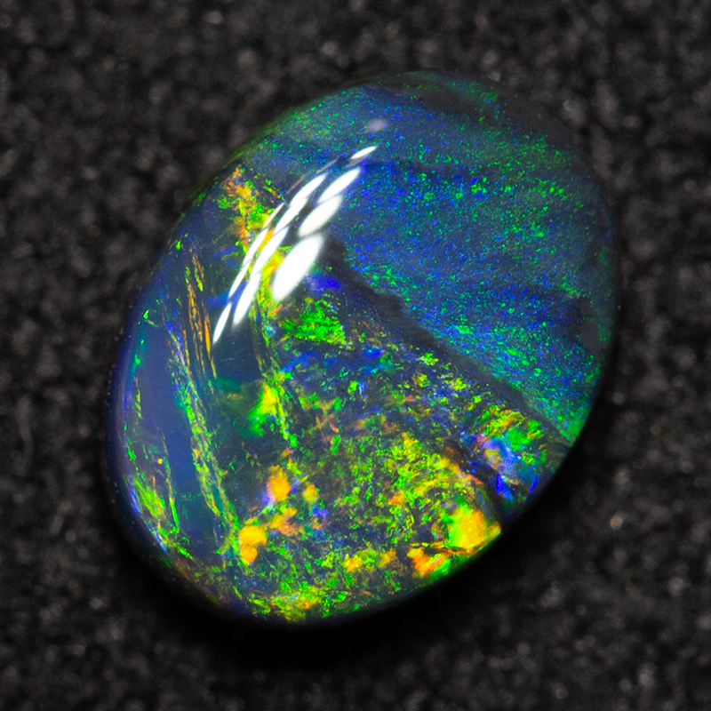 0.66 ct black opal 6.8x5.2x2.7mm