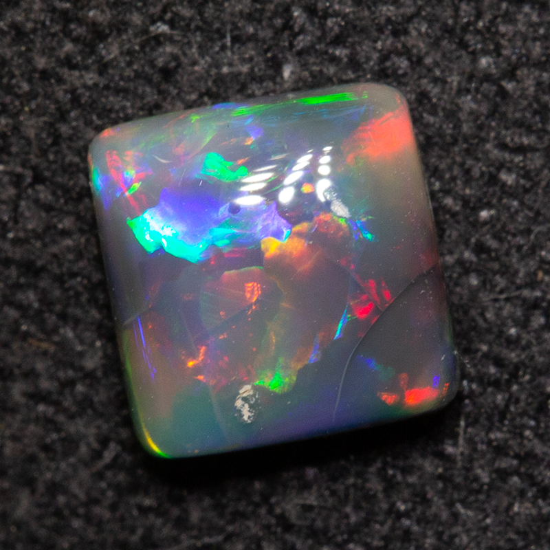 0.66 ct black opal 5.5x5.3x2.8mm
