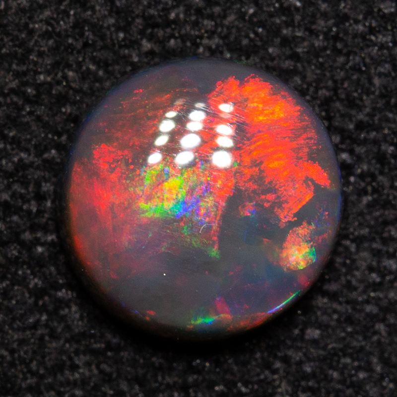 0.66 ct black opal 6.2x6.1x2.5mm