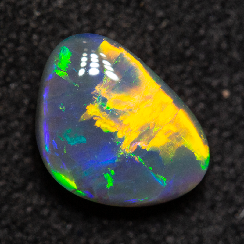 0.82 ct black opal 7.1x5.2x3.3mm