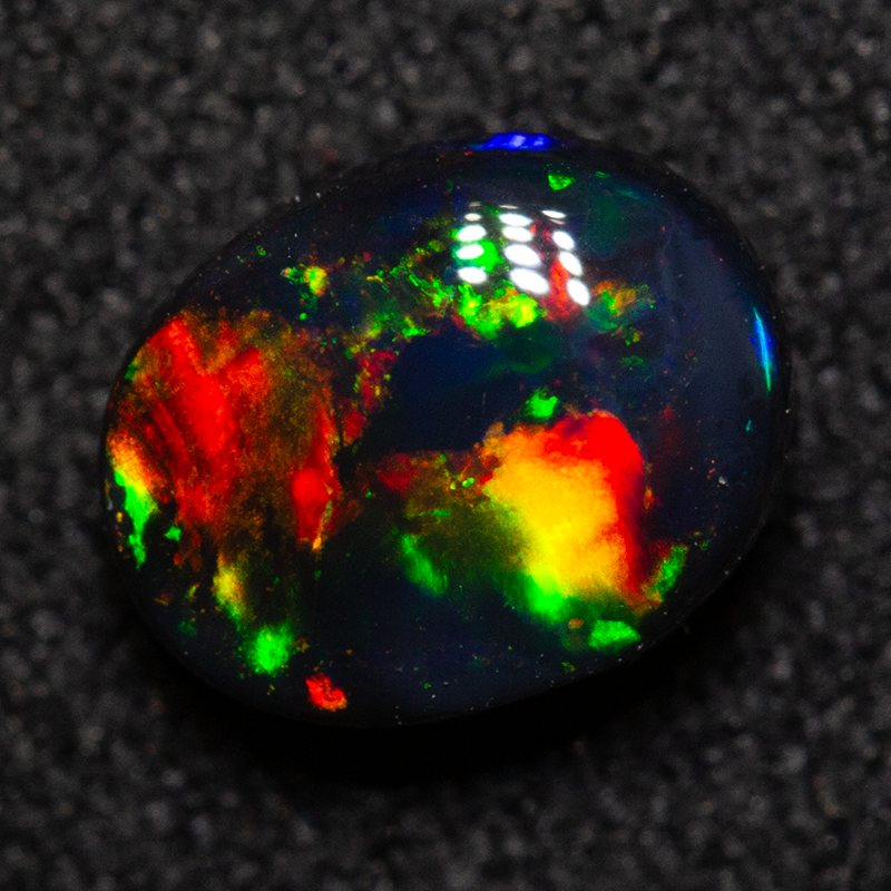 0.88 ct black opal 6.8x5.4x3.6mm