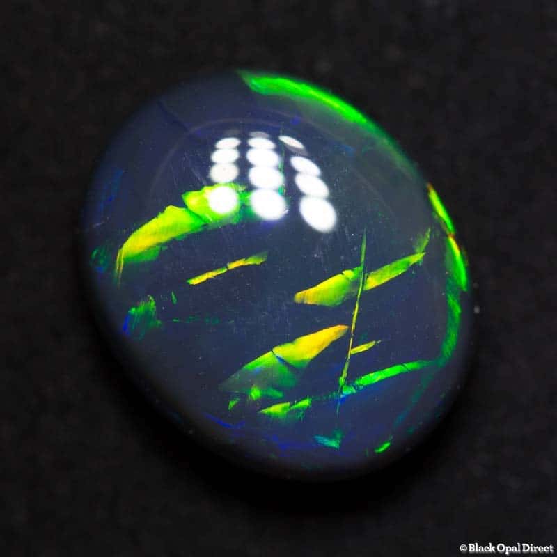 8.79 ct black opal gem with Chinese writing 15x12x7mm